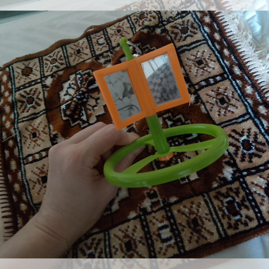 Игрушка для попугая